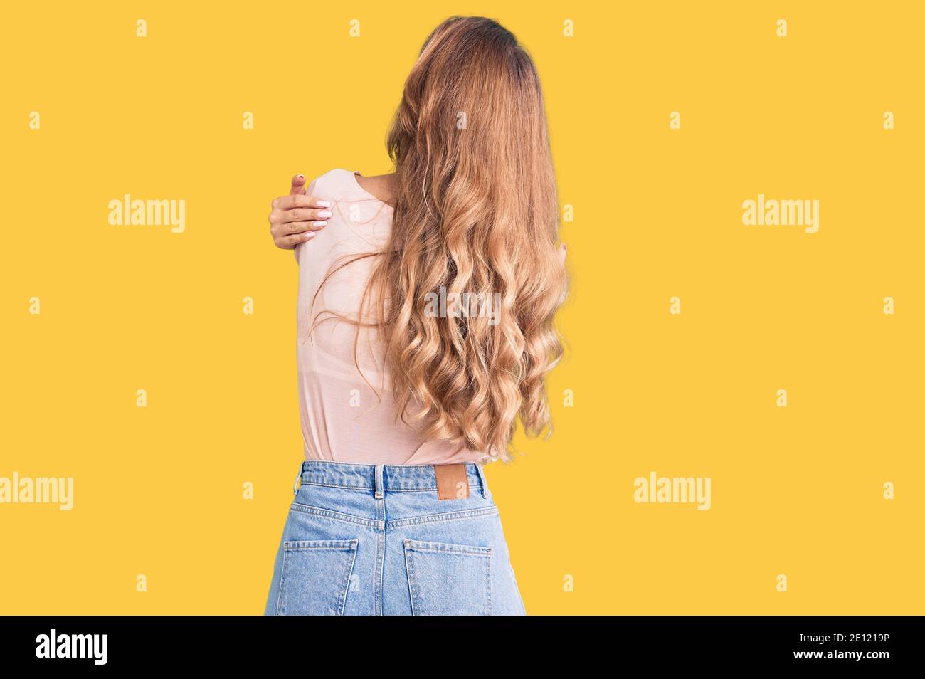 Young beautiful caucasian woman with blond hair wearing casual clothes ...