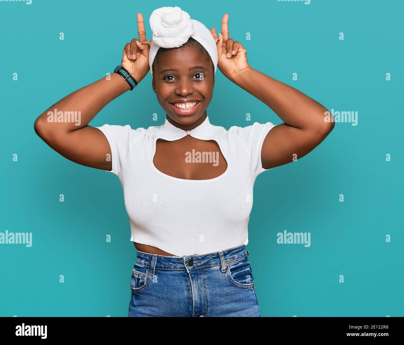 Young african woman with turban wearing hair turban over isolated ...