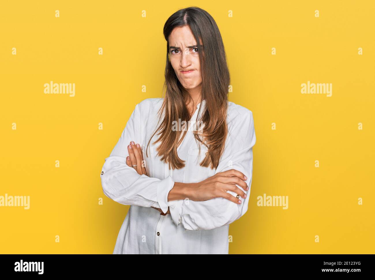 Young beautiful woman wearing casual clothes skeptic and nervous ...