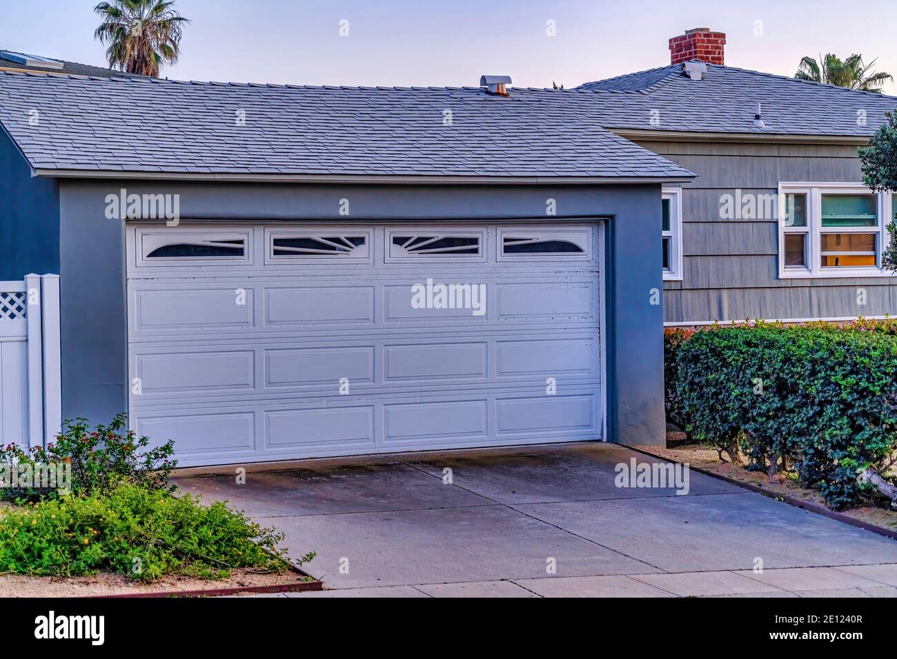 Single storey house with attached garage and gray wall cladding in San ...