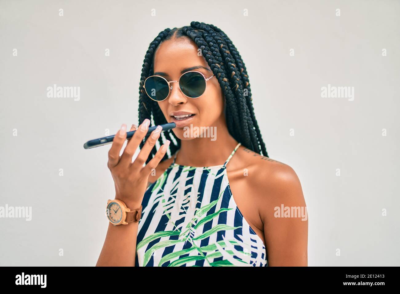 Young african american woman smiling happy sending voice message using ...