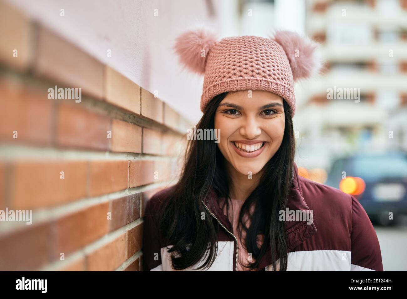 Young hispanic girl smiling happy standing at the city Stock Photo - Alamy