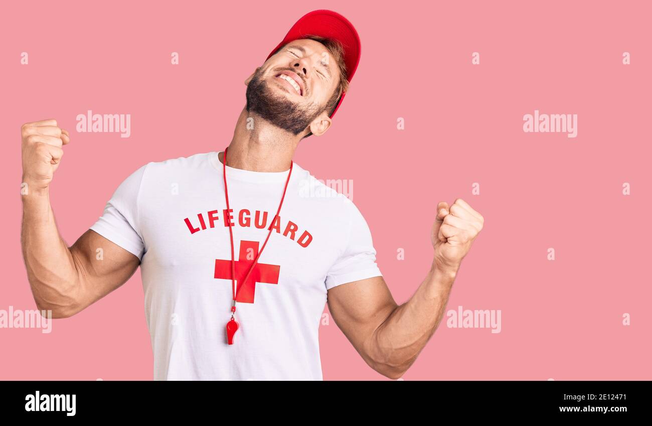 Young caucasian man wearing lifeguard t shirt holding whistle very ...