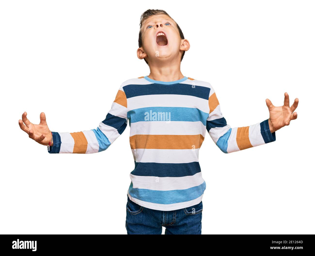 Adorable caucasian kid wearing casual clothes crazy and mad shouting ...