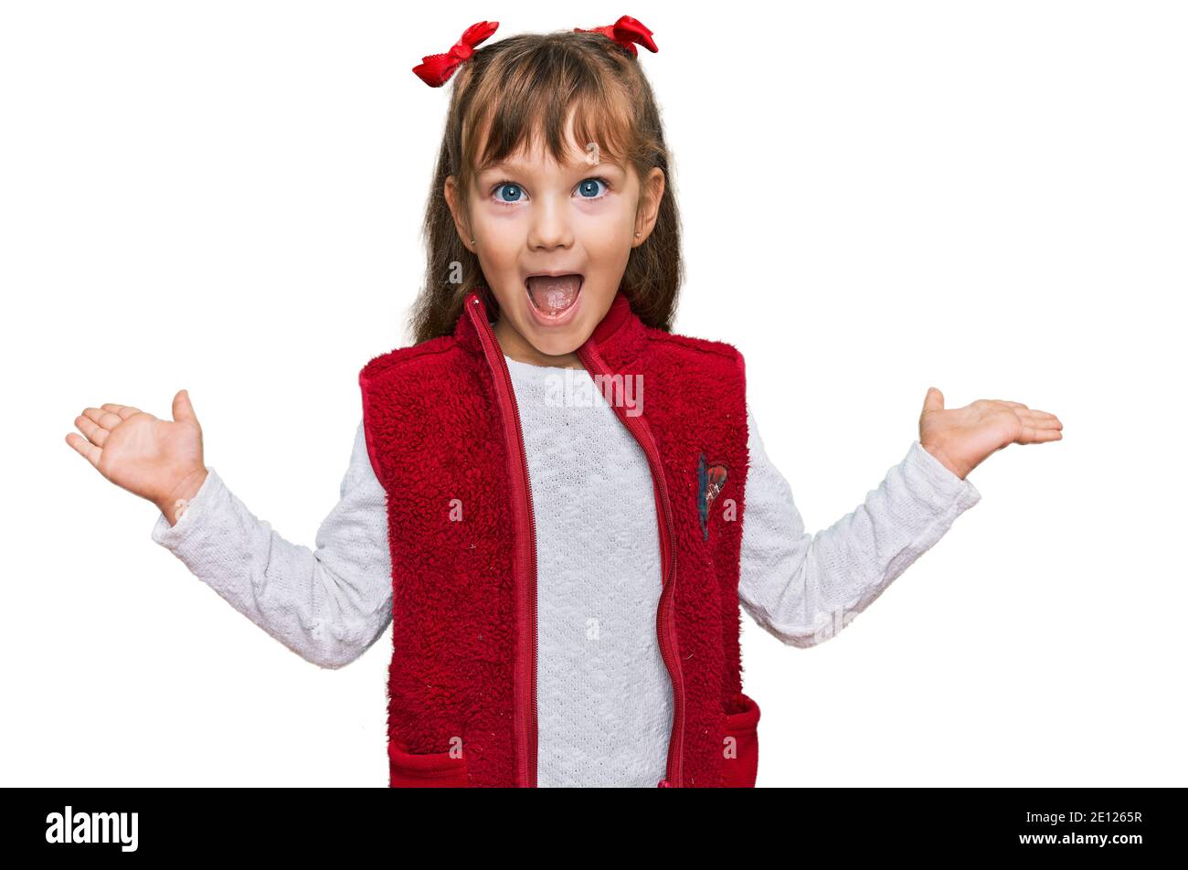 Little caucasian girl kid wearing casual clothes celebrating victory ...