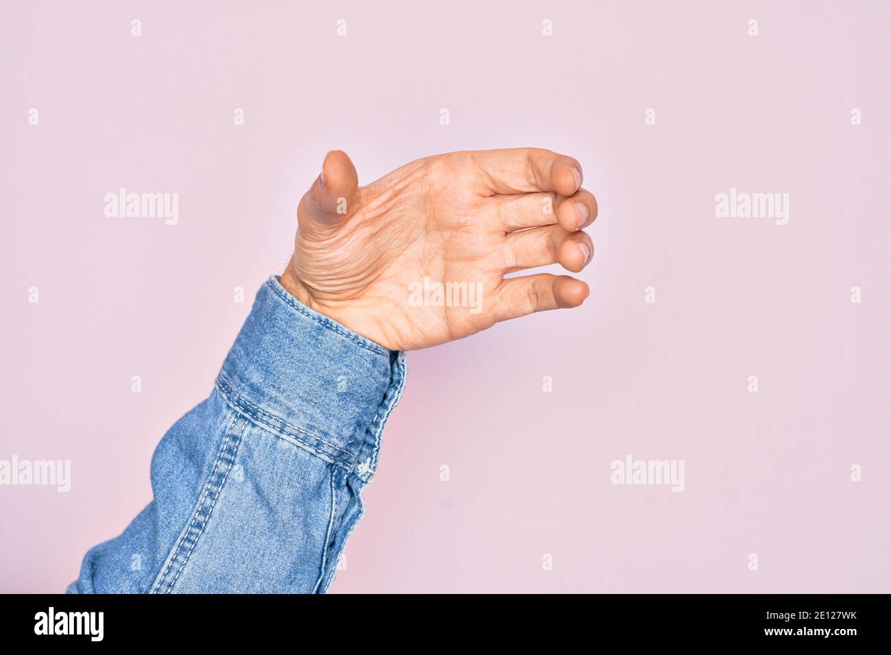 Hand of caucasian young man showing fingers over isolated pink ...