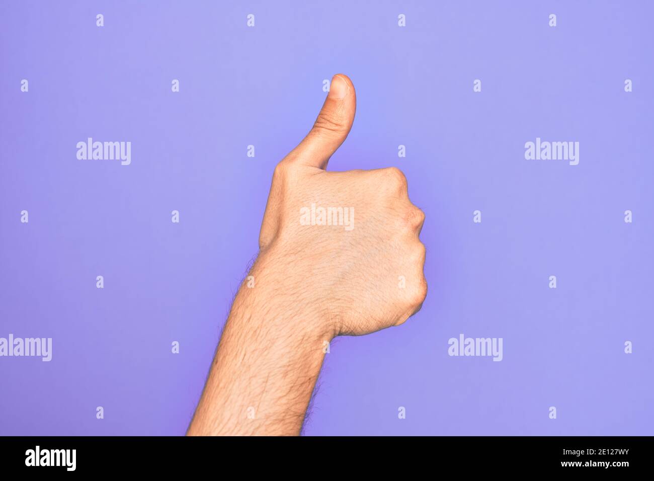 Hand of caucasian young man showing fingers over isolated purple ...