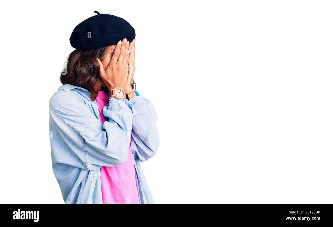 Young beautiful mixed race woman wearing french look with beret with ...
