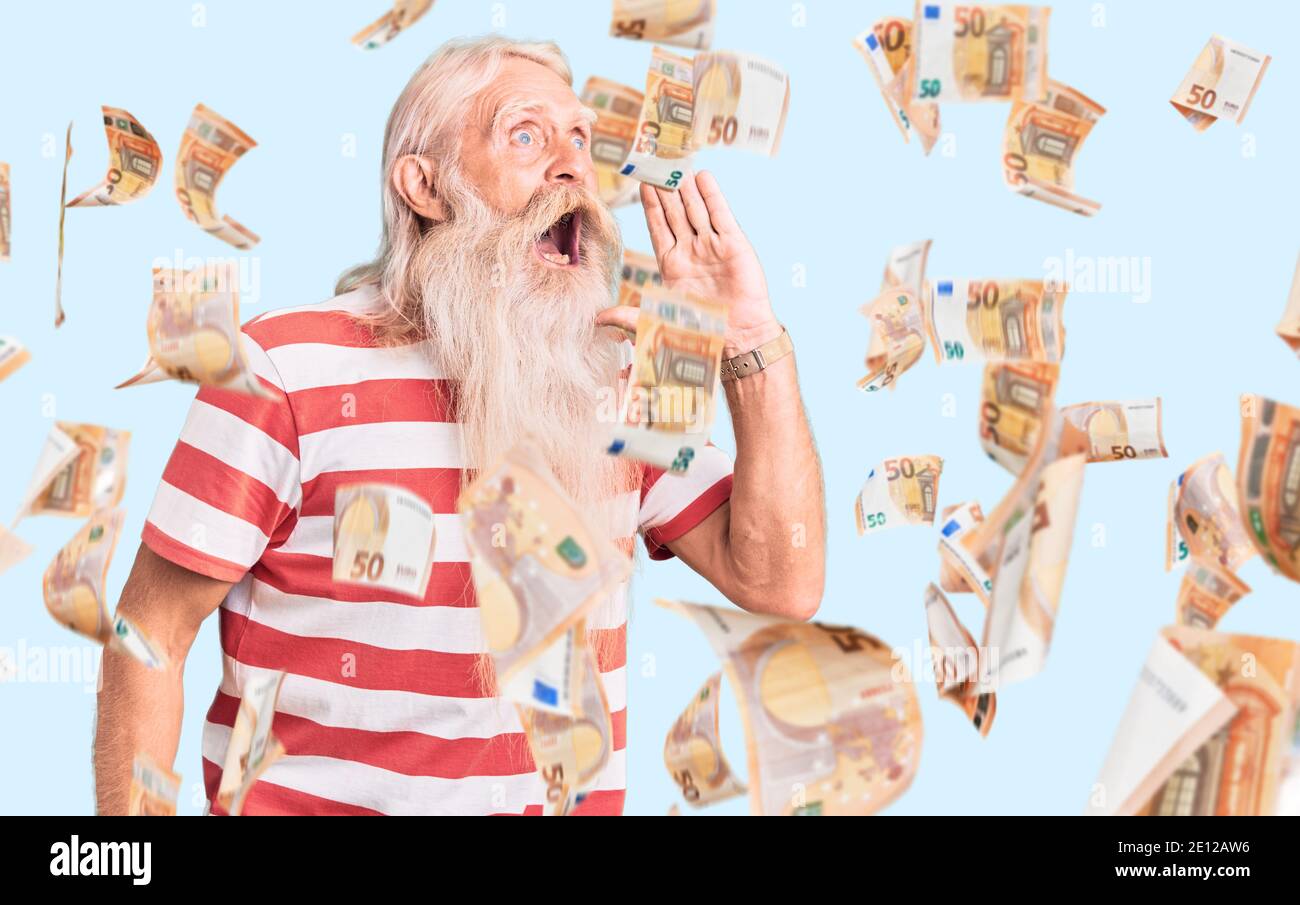 Old senior man with grey hair and long beard wearing striped tshirt ...