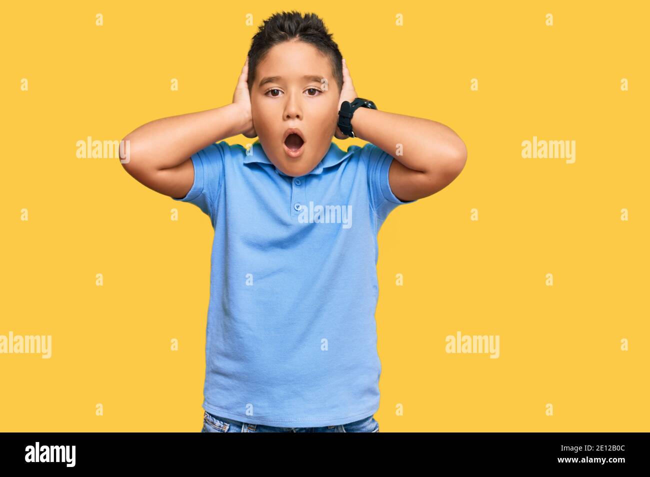 Little boy hispanic kid wearing casual clothes crazy and scared with ...