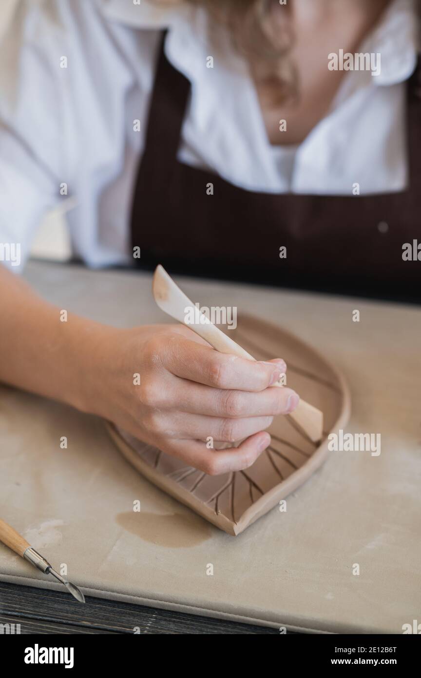 Moulding clay hands woman hi-res stock photography and images - Alamy