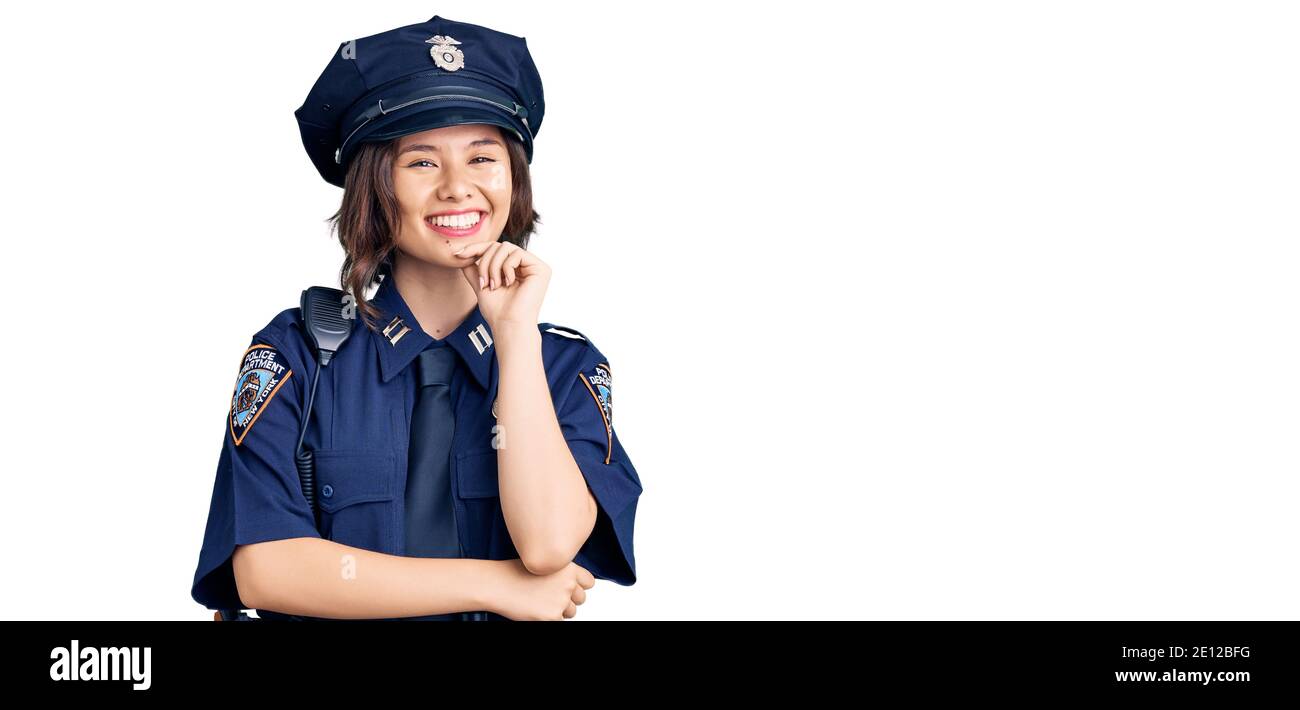 Young beautiful girl wearing police uniform looking confident at the ...