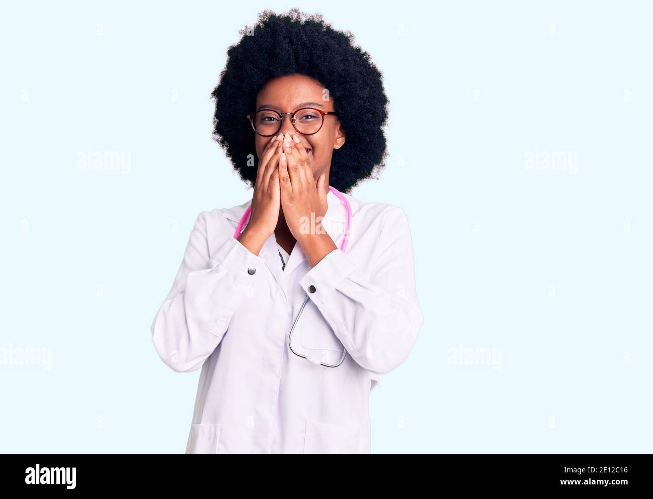 Young african american woman wearing doctor coat and stethoscope ...