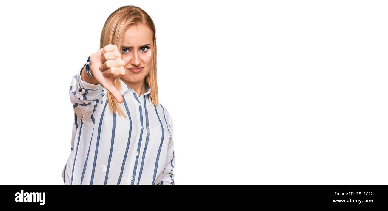 Beautiful caucasian woman wearing casual clothes looking unhappy and ...