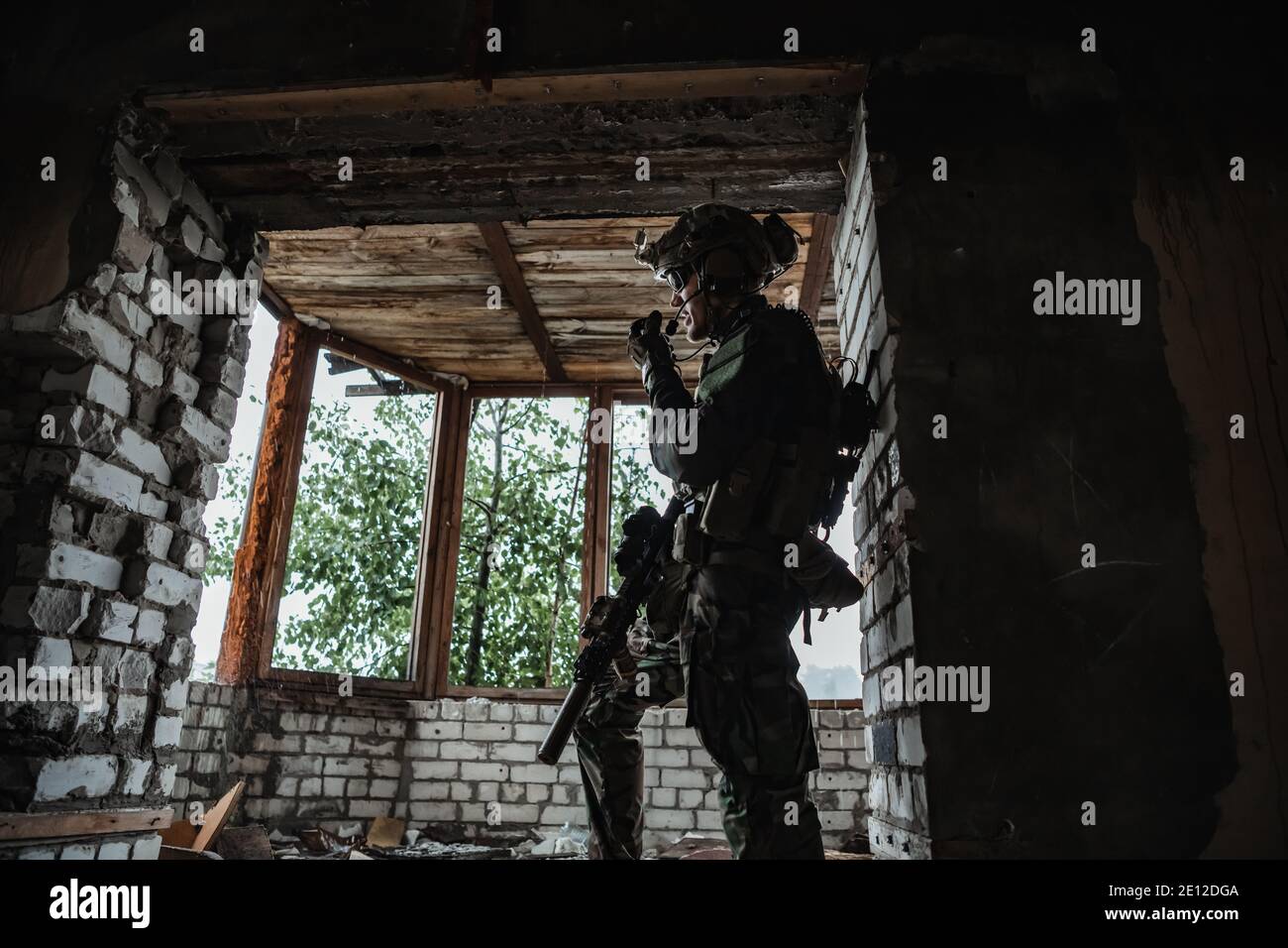 Military man standing inside the building and waiting for command Stock ...