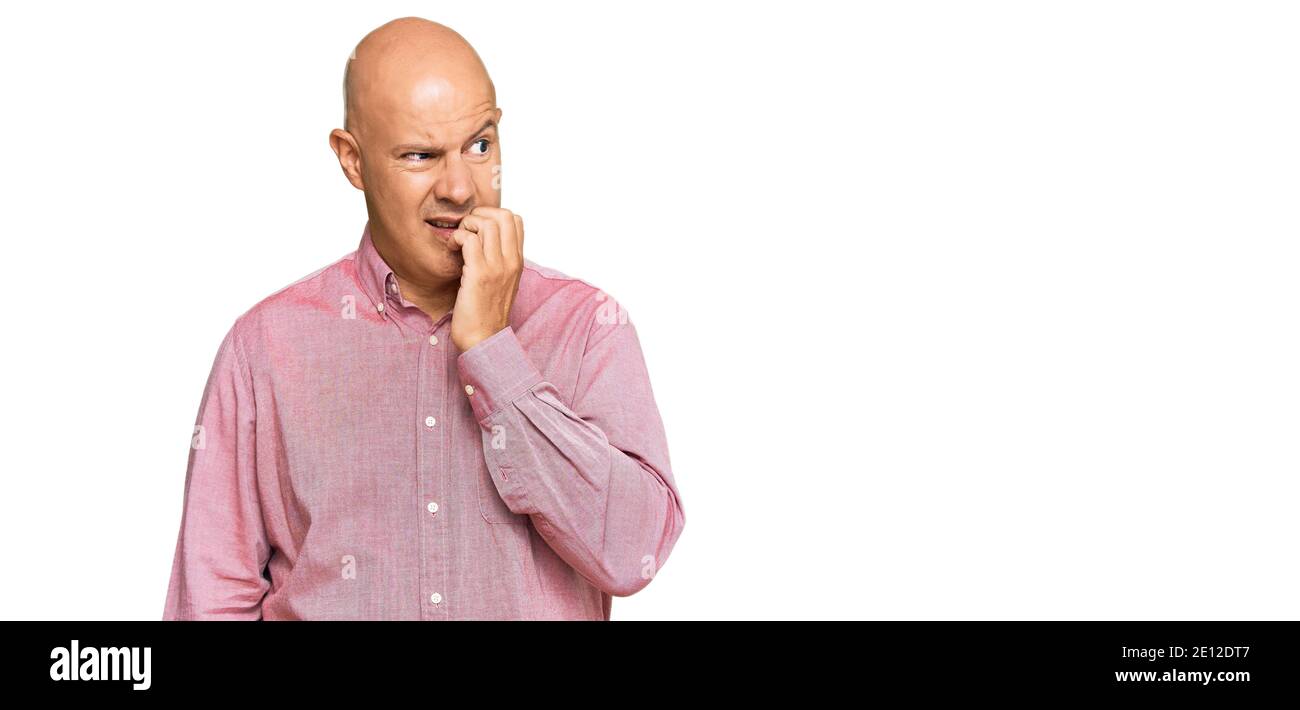 Middle age bald man wearing casual clothes looking stressed and nervous ...