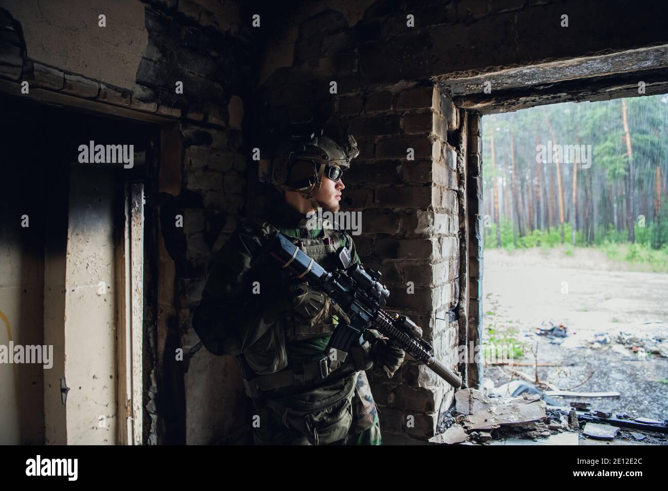 Front view close up of caucasian soldier with a rifle stand guard ...