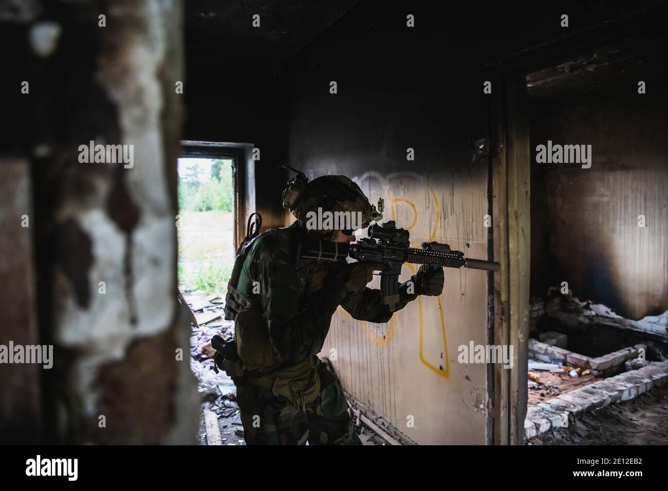 Soldier in full US MARSOC armed with assault rifle run through the ...