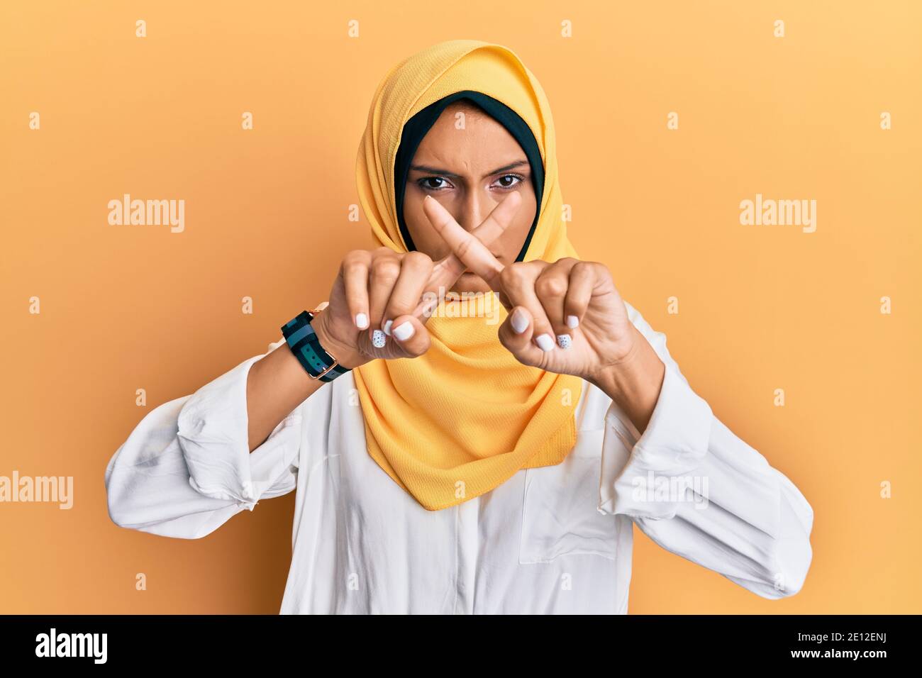 Young brunette arab woman wearing traditional islamic hijab scarf ...