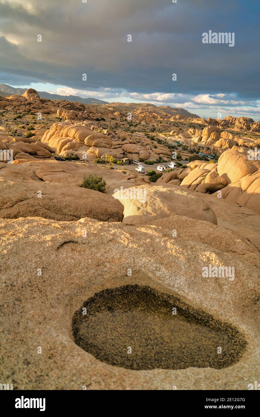 Puddle of water on rocks with erosion at Joshua Tree National Park in ...