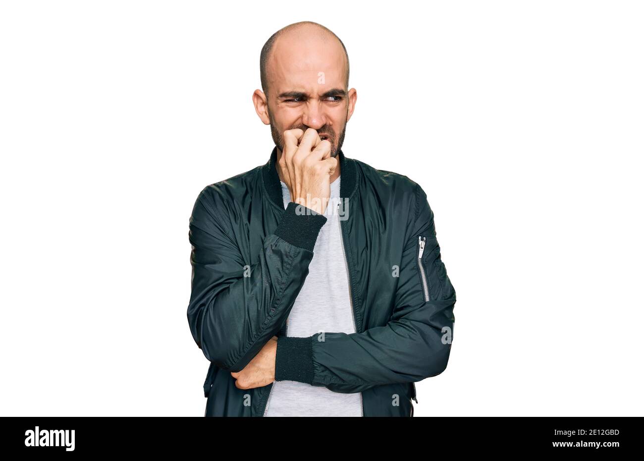 Young hispanic man wearing casual clothes looking stressed and nervous ...
