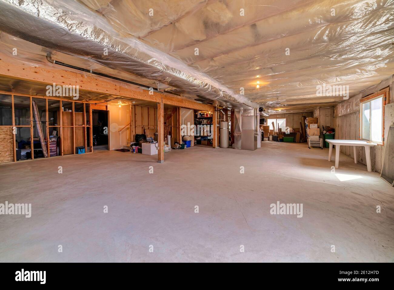 Interior view of a house under construction with plastic cover on the ...