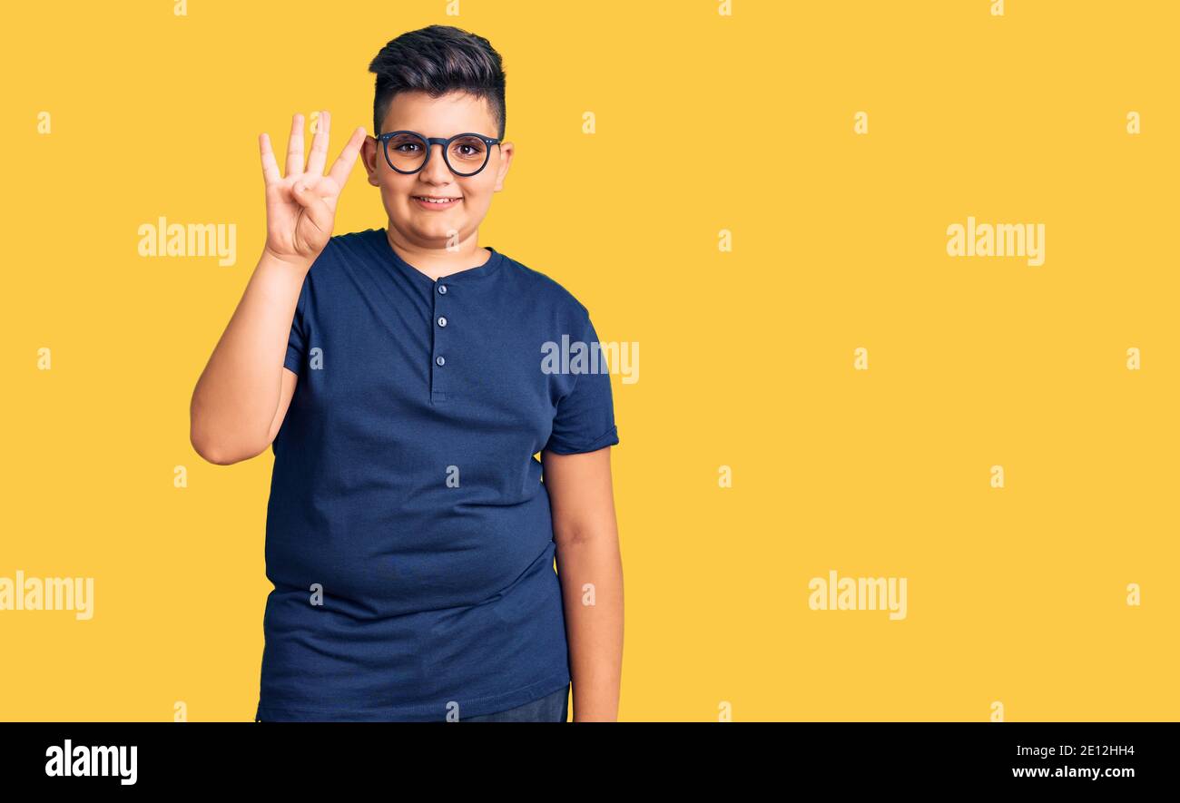 Little boy kid wearing casual clothes and glasses showing and pointing ...