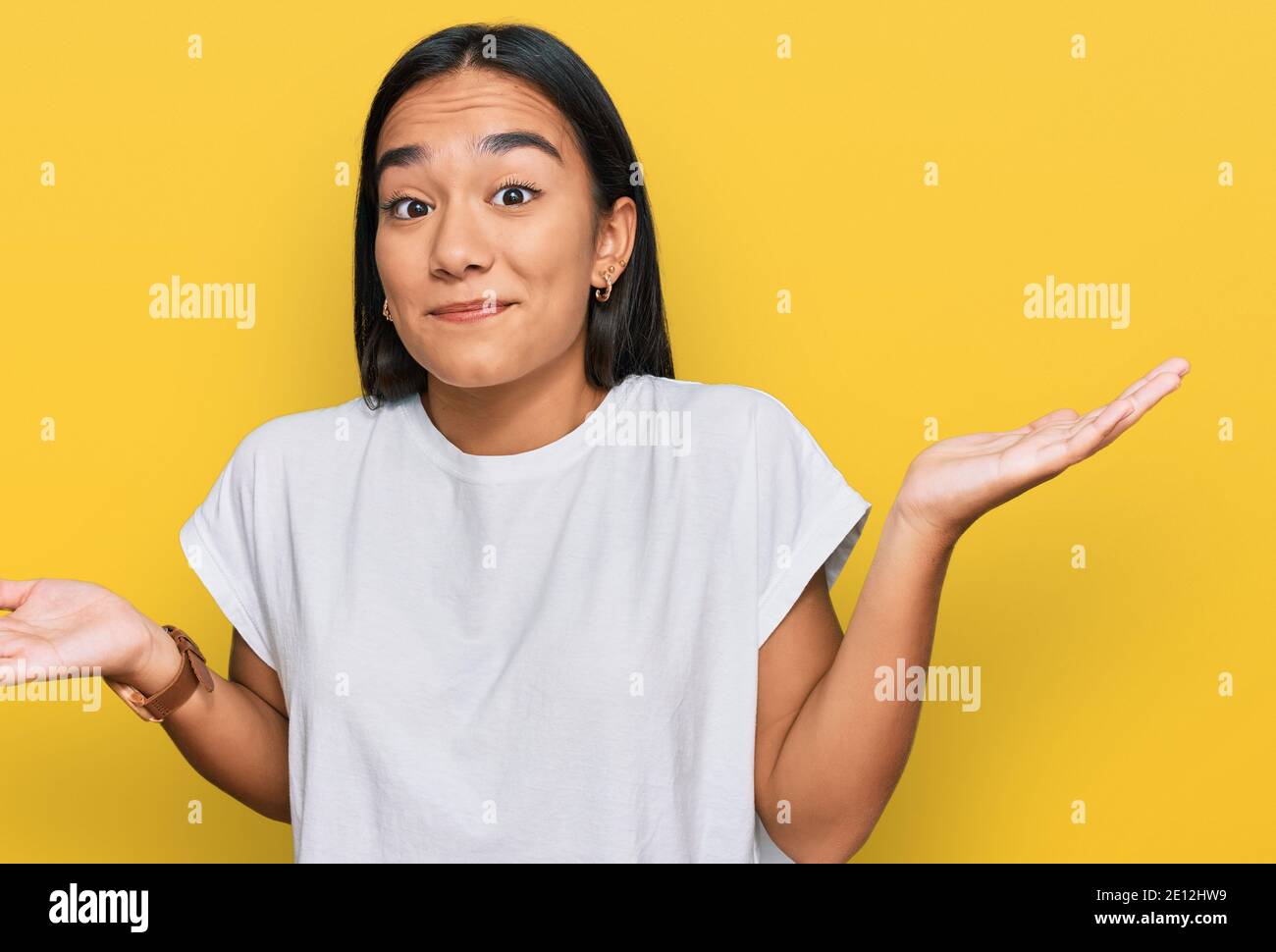 Young Asian Woman Wearing Casual White T Shirt Clueless And Confused