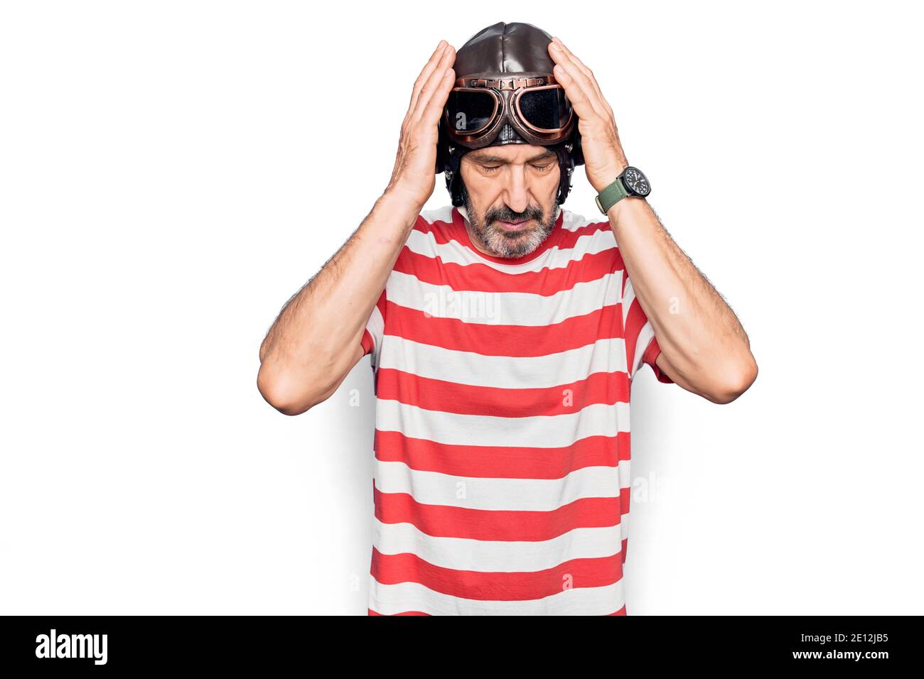 Middle age aviator man wearing vintage helmet and glasses over isolated ...