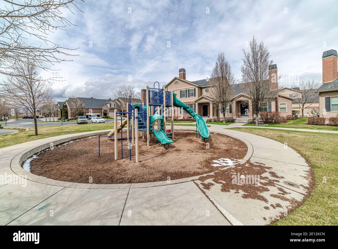 Childrens playground and circular pathway at a park in teh neighborhood ...