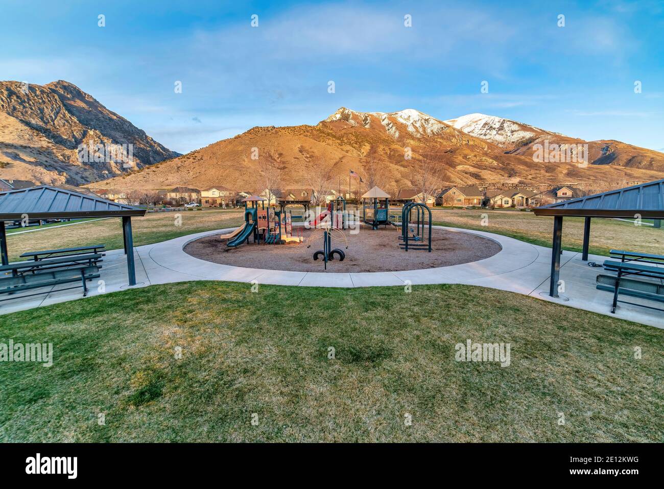 Playground in the middle of park with spectacular mountain and blue sky ...