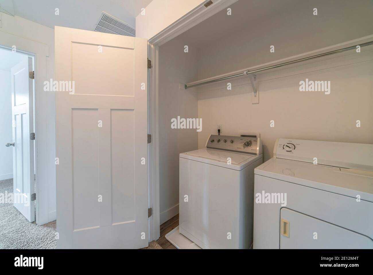 Small room inside a residential house with washing machine and dryer ...