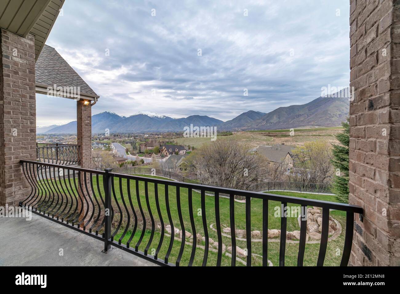 View of the neighborhood and mountain in the valley from the porch of a ...