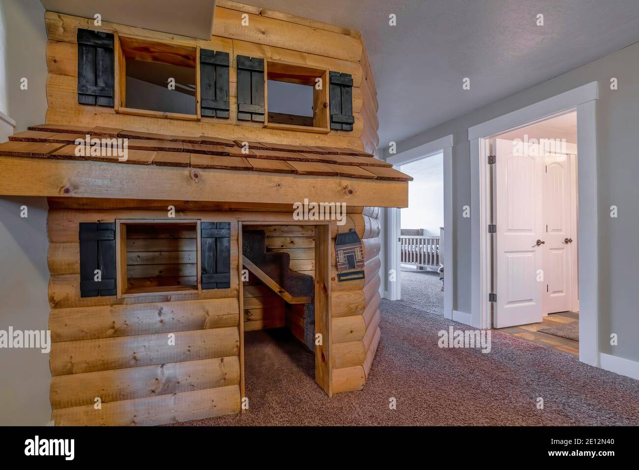 Built in indoor cabin playhouse for children with brown log wall and ...