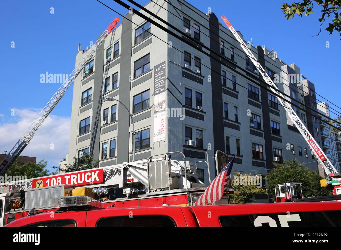 Firefighters rescue people in high modern building to escape by ...