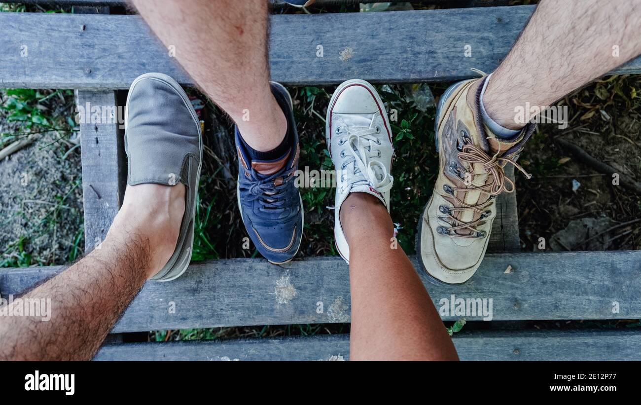 four different friends shoes Stock Photo - Alamy