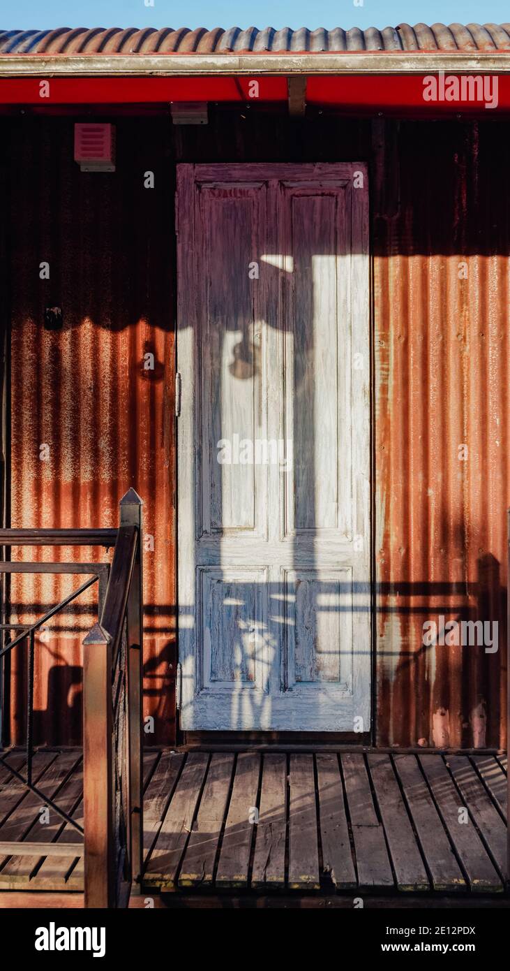 a wooden door in a rusty container Stock Photo - Alamy