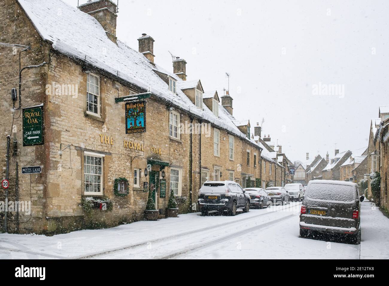 The Royal Oak pub in the snow in Witney street at christmas. Burford ...