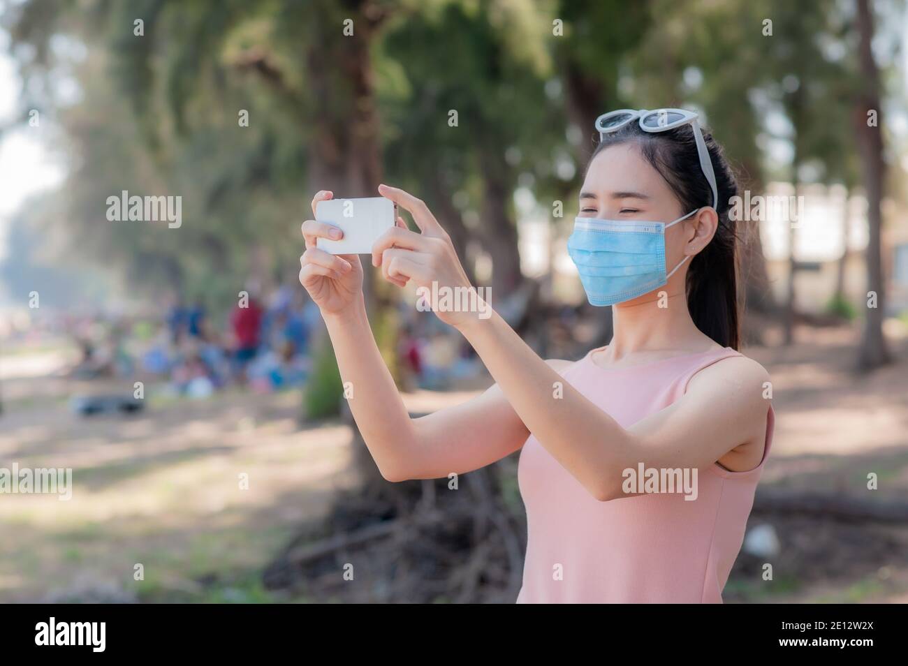 Asian women wear medical mask travel on beach sea Thailand, New normal ...
