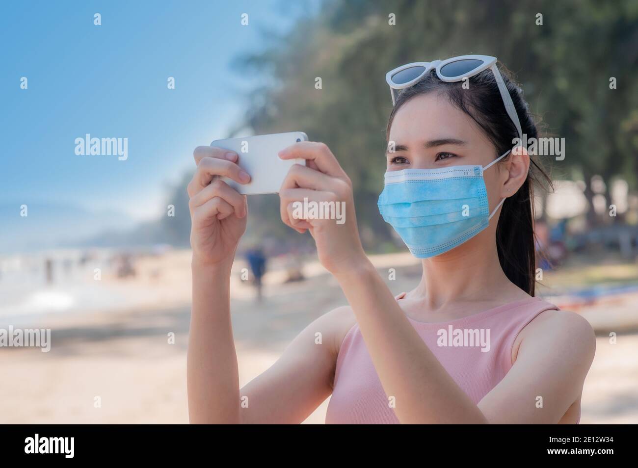 Asian women wear medical mask travel on beach sea Thailand, New normal ...