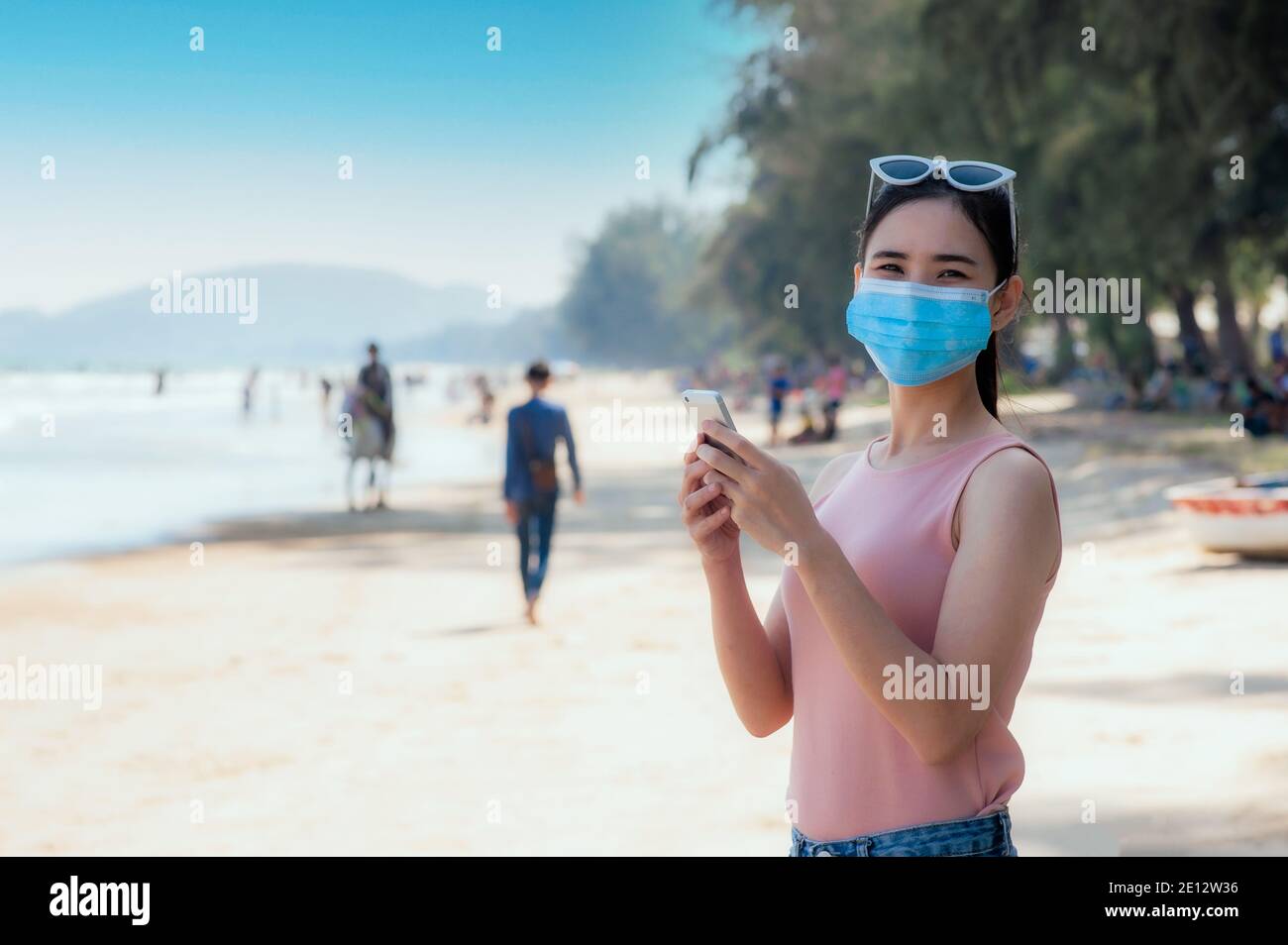 Asian women wear medical mask travel on beach sea Thailand, New normal ...