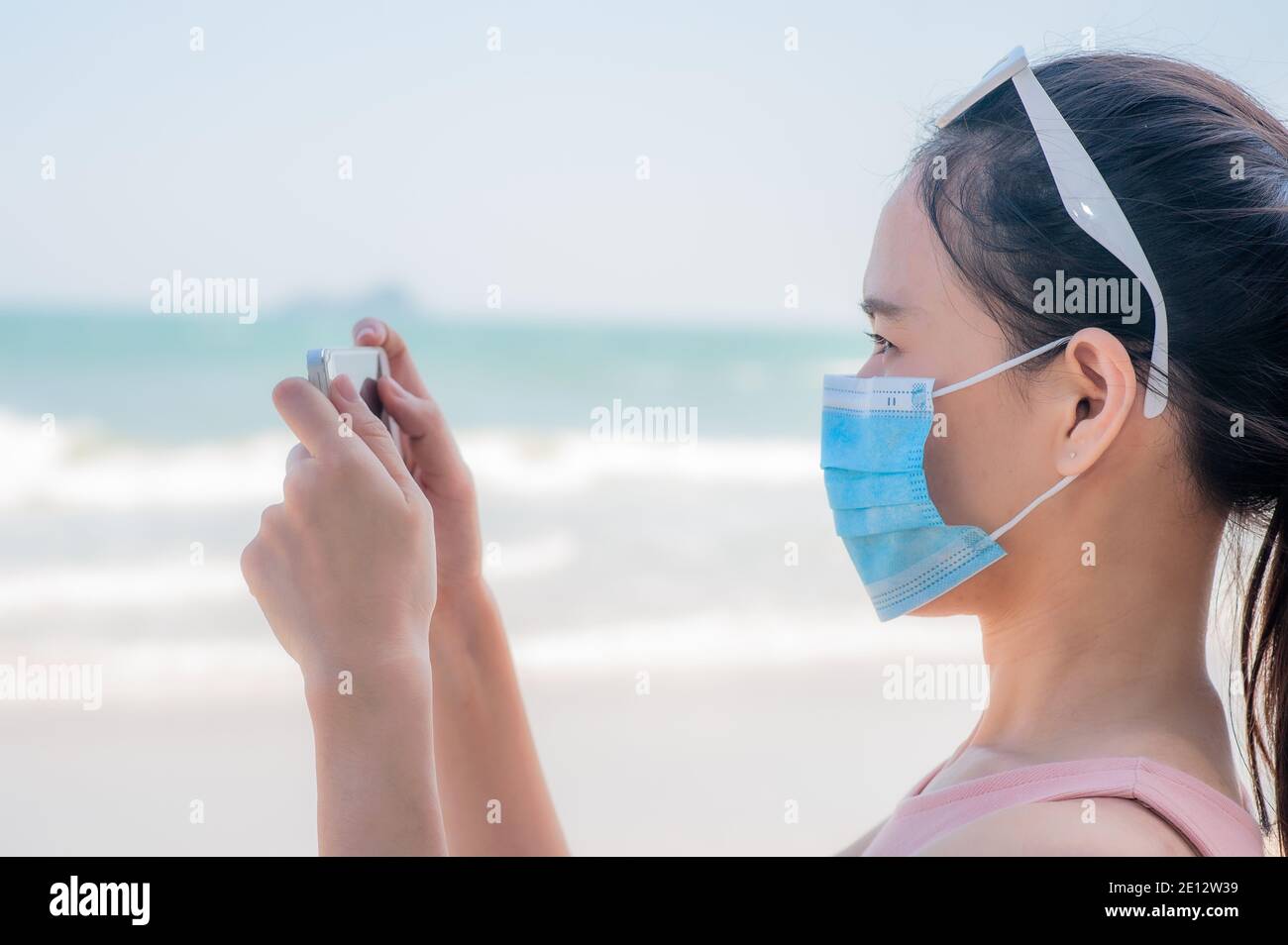 Asian women wear medical mask travel on beach sea Thailand, New normal ...