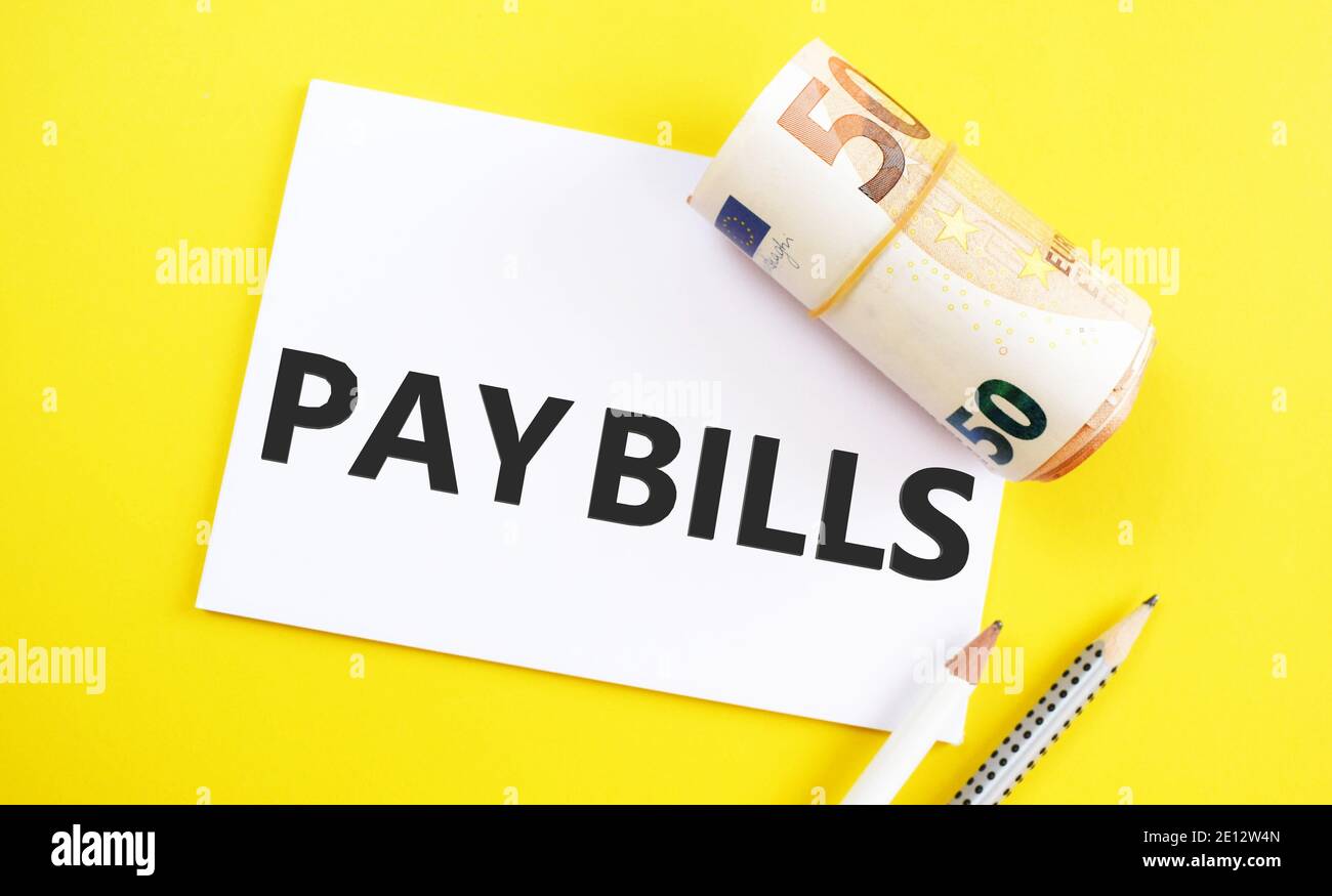 Pay bills text written on white paper.Business concept for Payment for ...