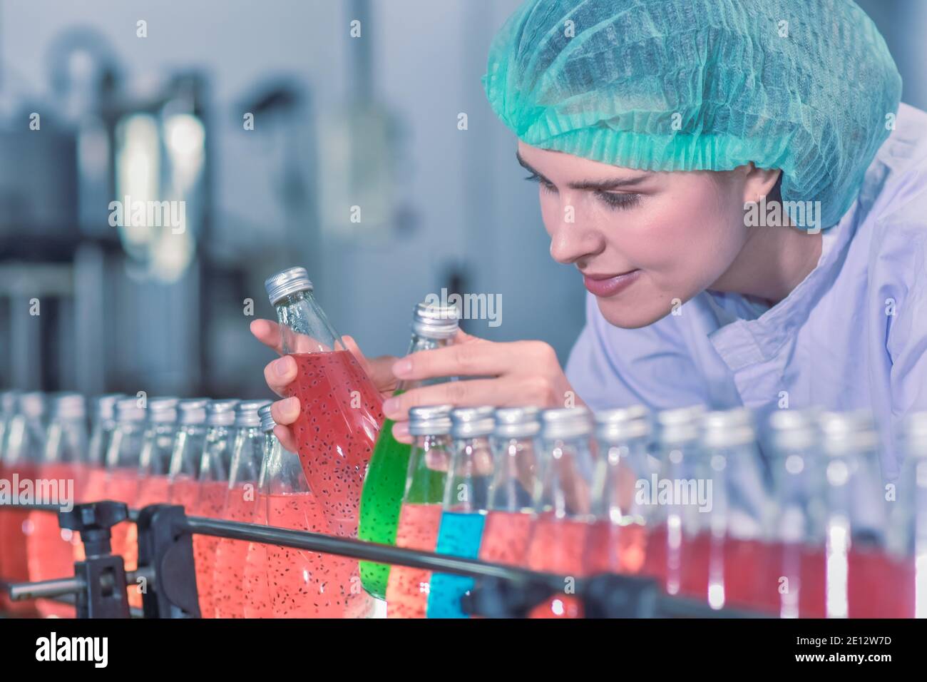 Worker people check quality control in production process beverage in ...