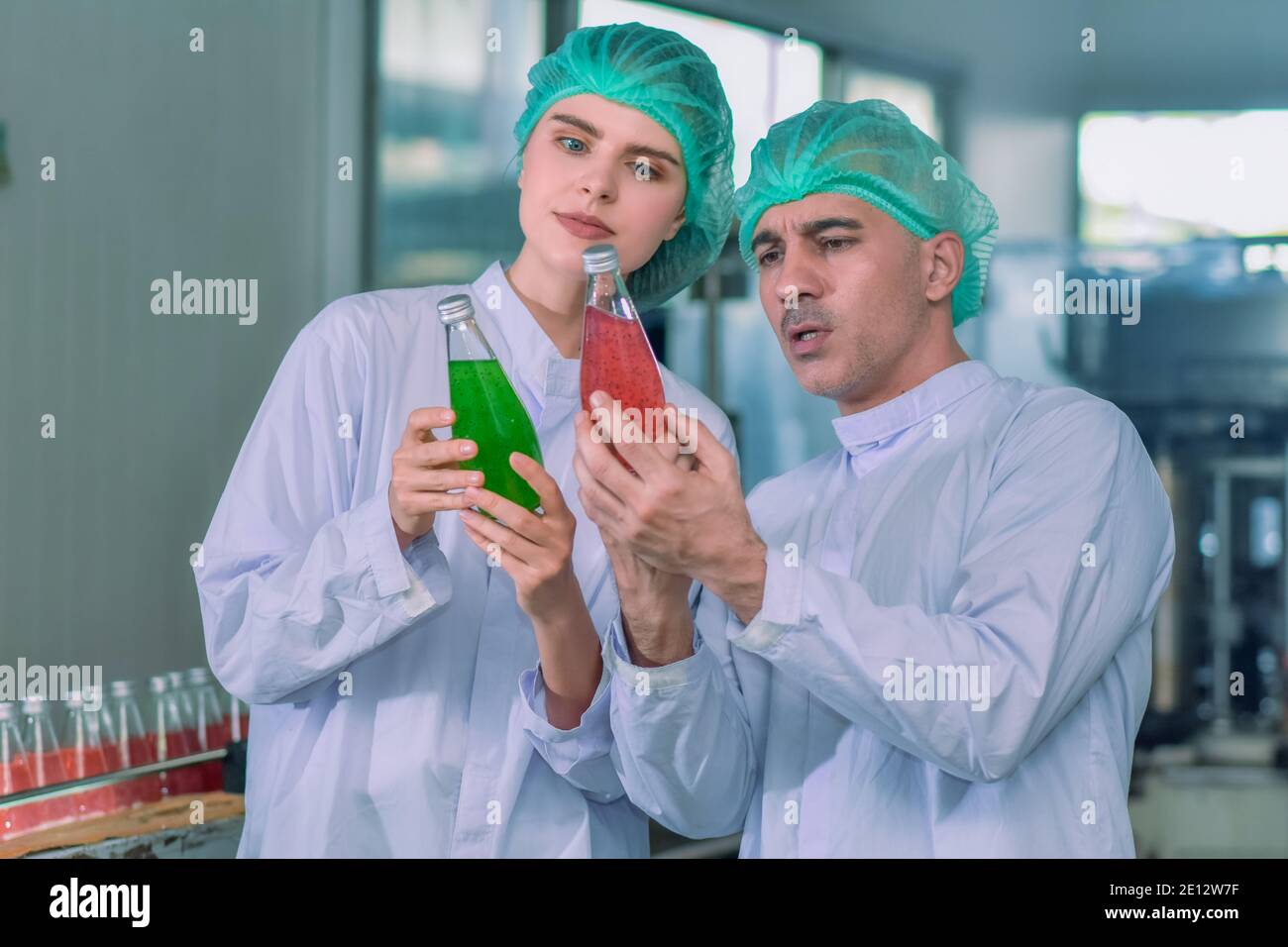 Worker people check quality control in production process beverage in ...
