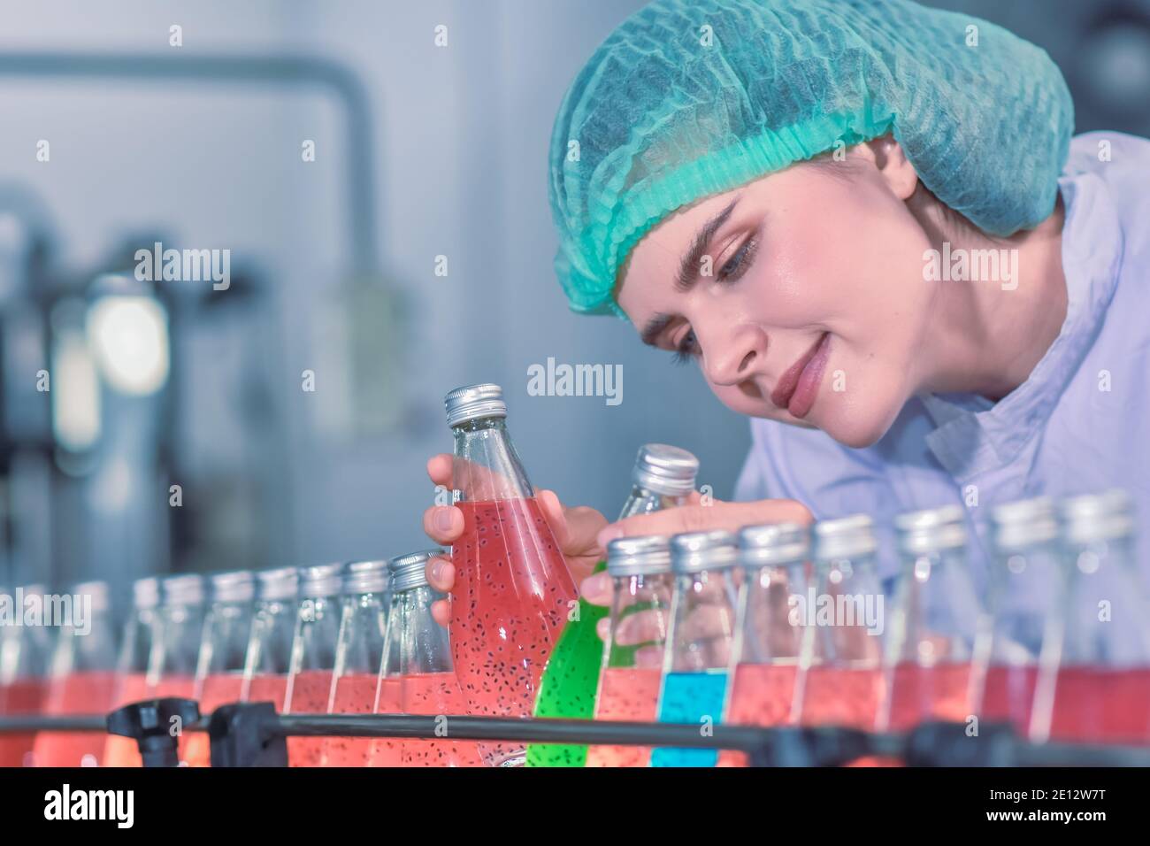 Worker people check quality control in production process beverage in ...
