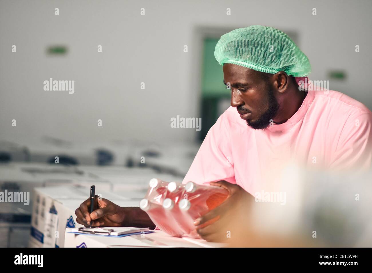 Workers checking product in Export warehouse, Man check beverage ...