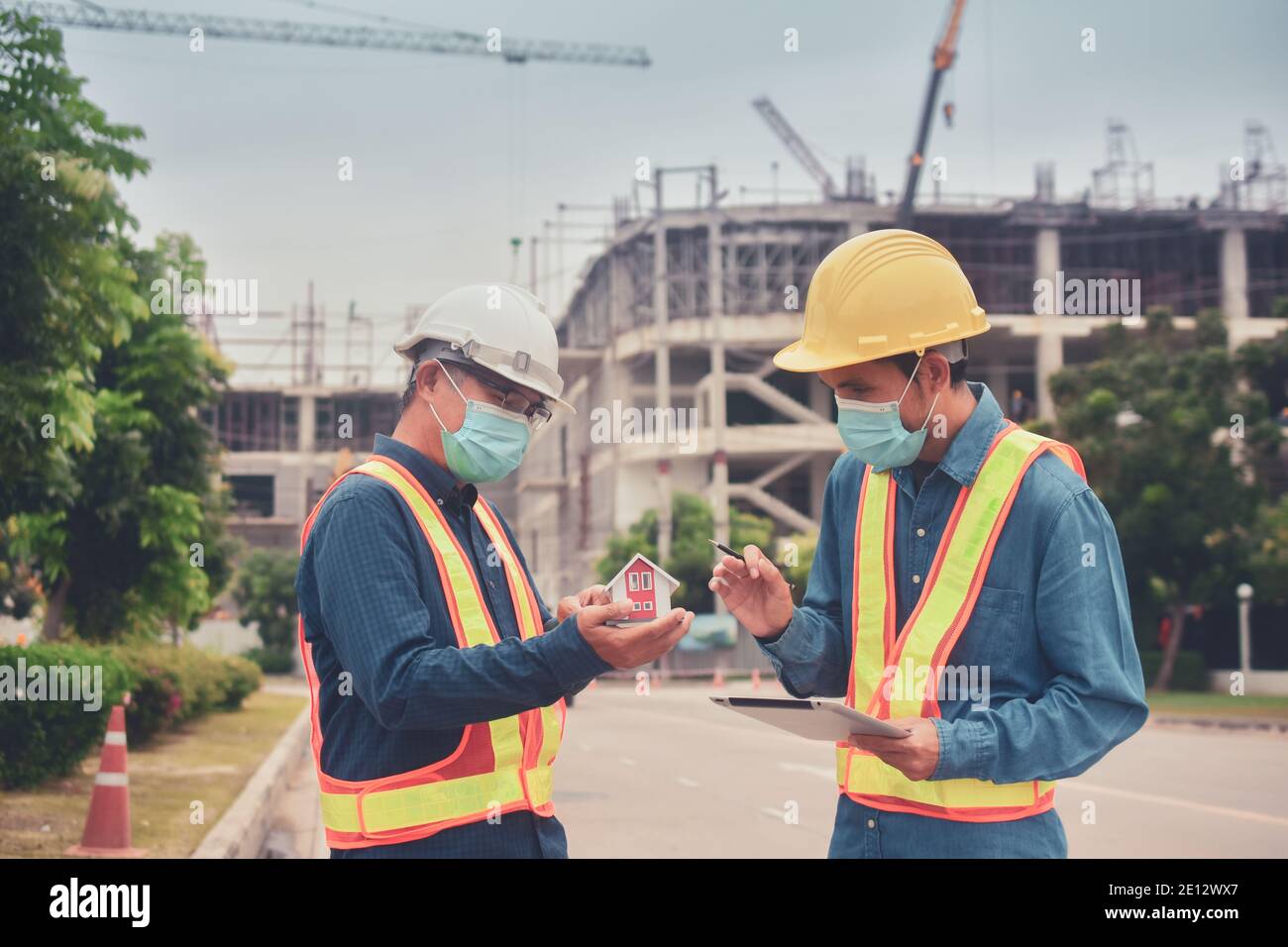 Asian man wear face mask worker working engineer on site construction ...