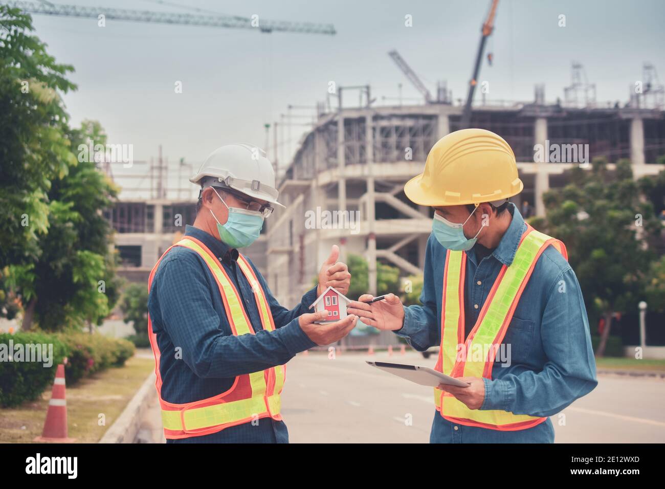 Asian man wear face mask worker working engineer on site construction ...