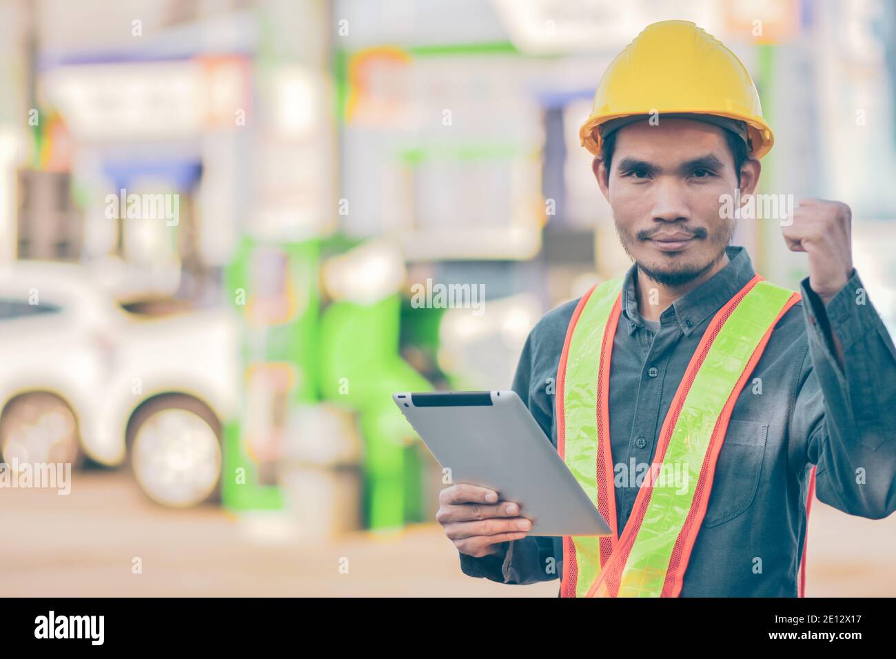 Asian man Engineer worker use tablet checking work on site road ...